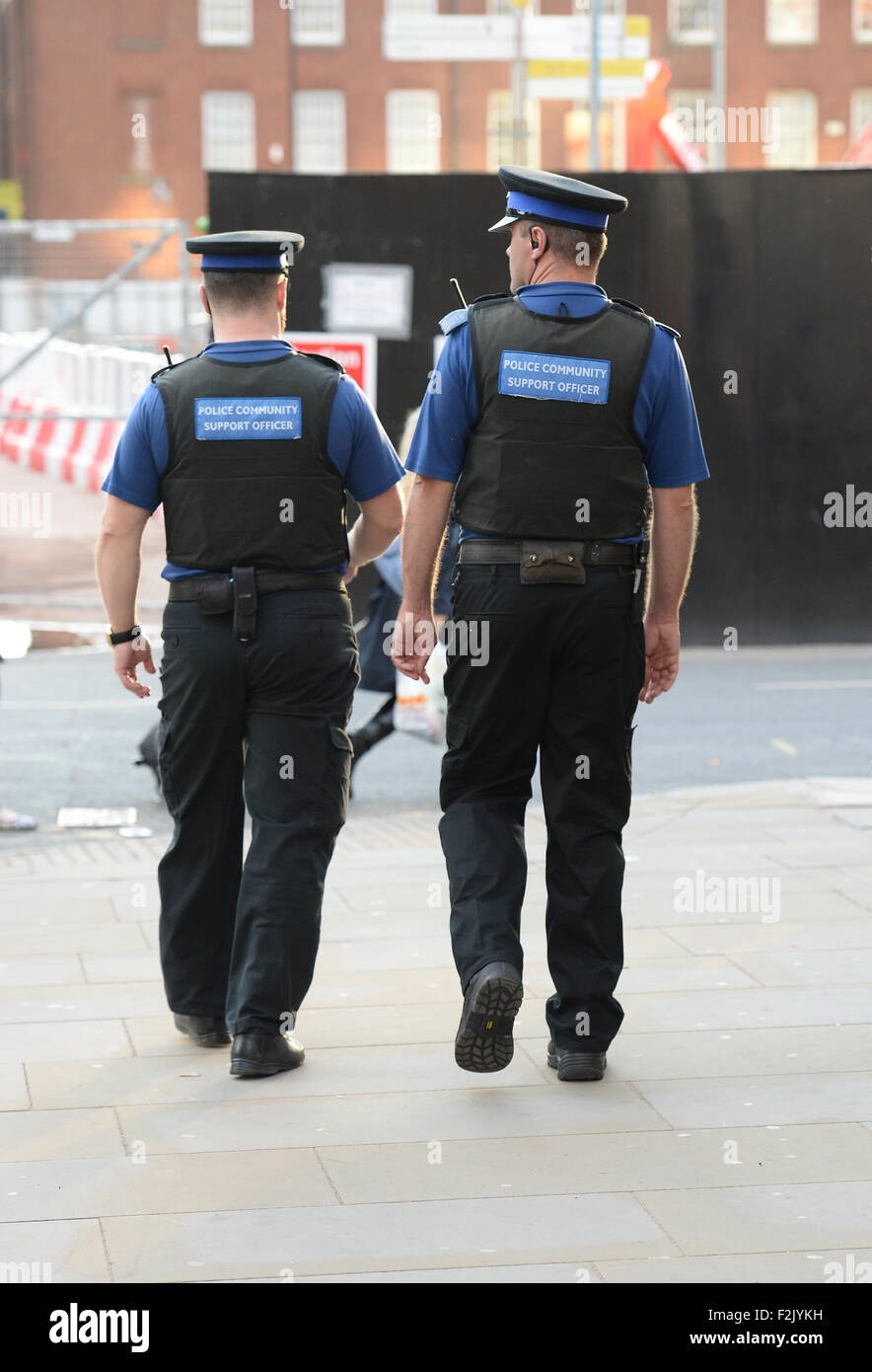 Two Greater Manchester Police Community Support Officers walk along ...
