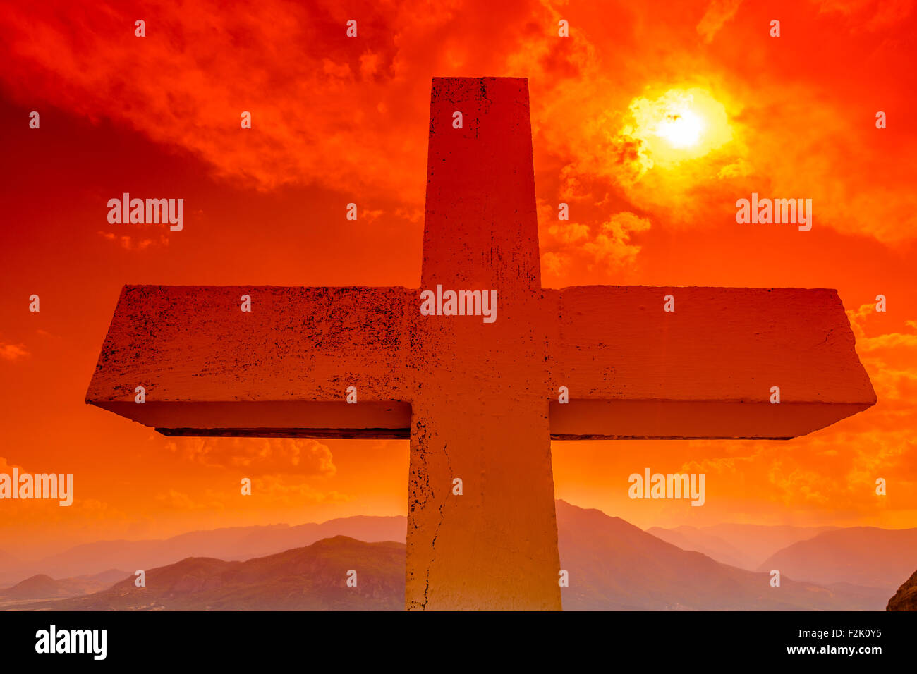 Cross at sunset Stock Photo - Alamy