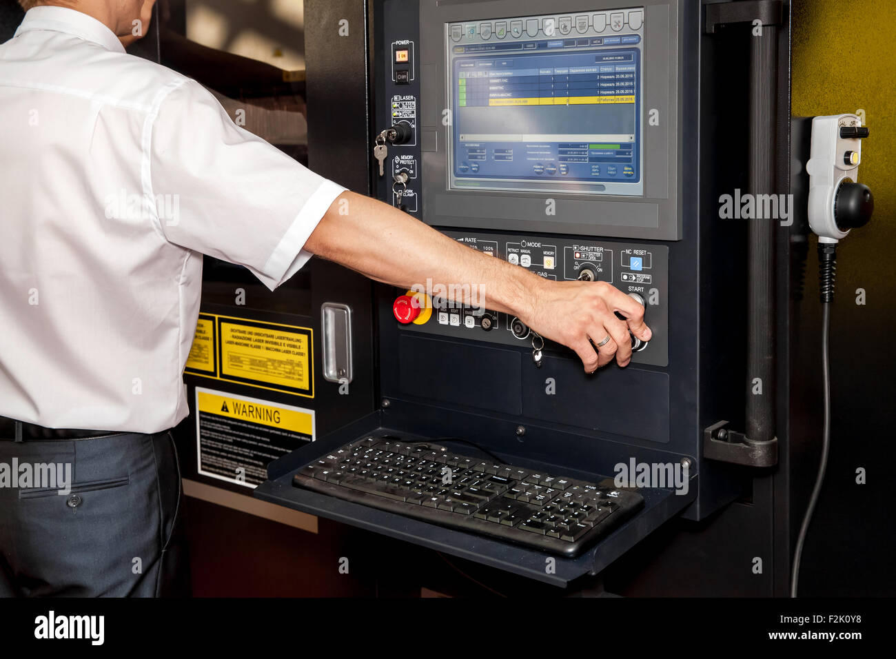 Automated workplace, engineer's hand on the working computer panel of ...