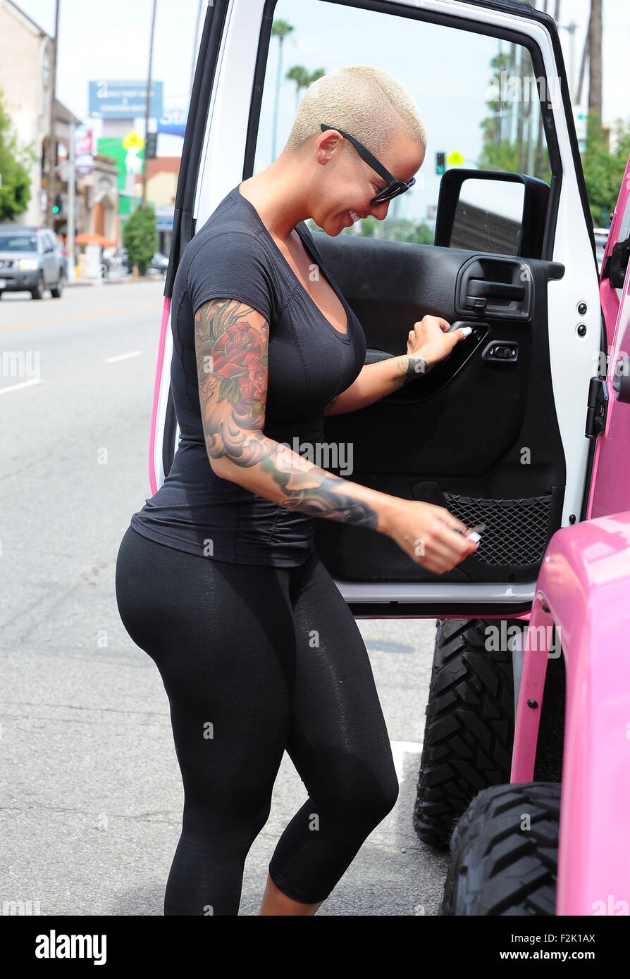 Amber Rose, holding a Givenchy bag, leaving a salon in Los Angeles ...