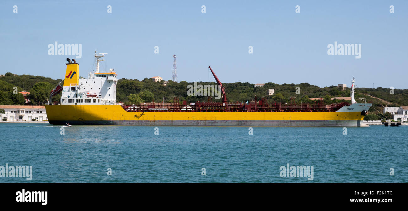 Yellow cargo ship in Mahon harbour, Menorca Stock Photo - Alamy