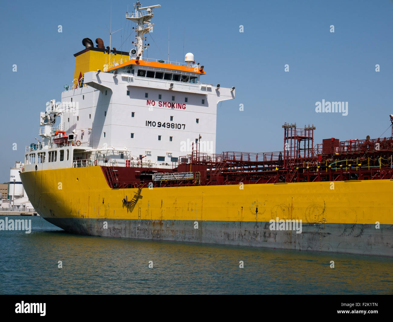 Yellow cargo ship Stock Photo - Alamy