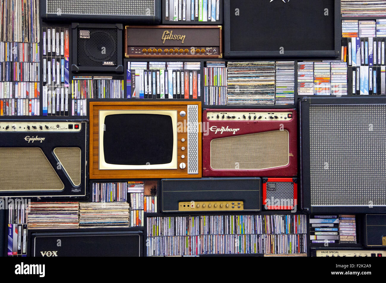 Wall of vintage and retro cds, vinyls, tv, amplifiers, VHS and audio ...