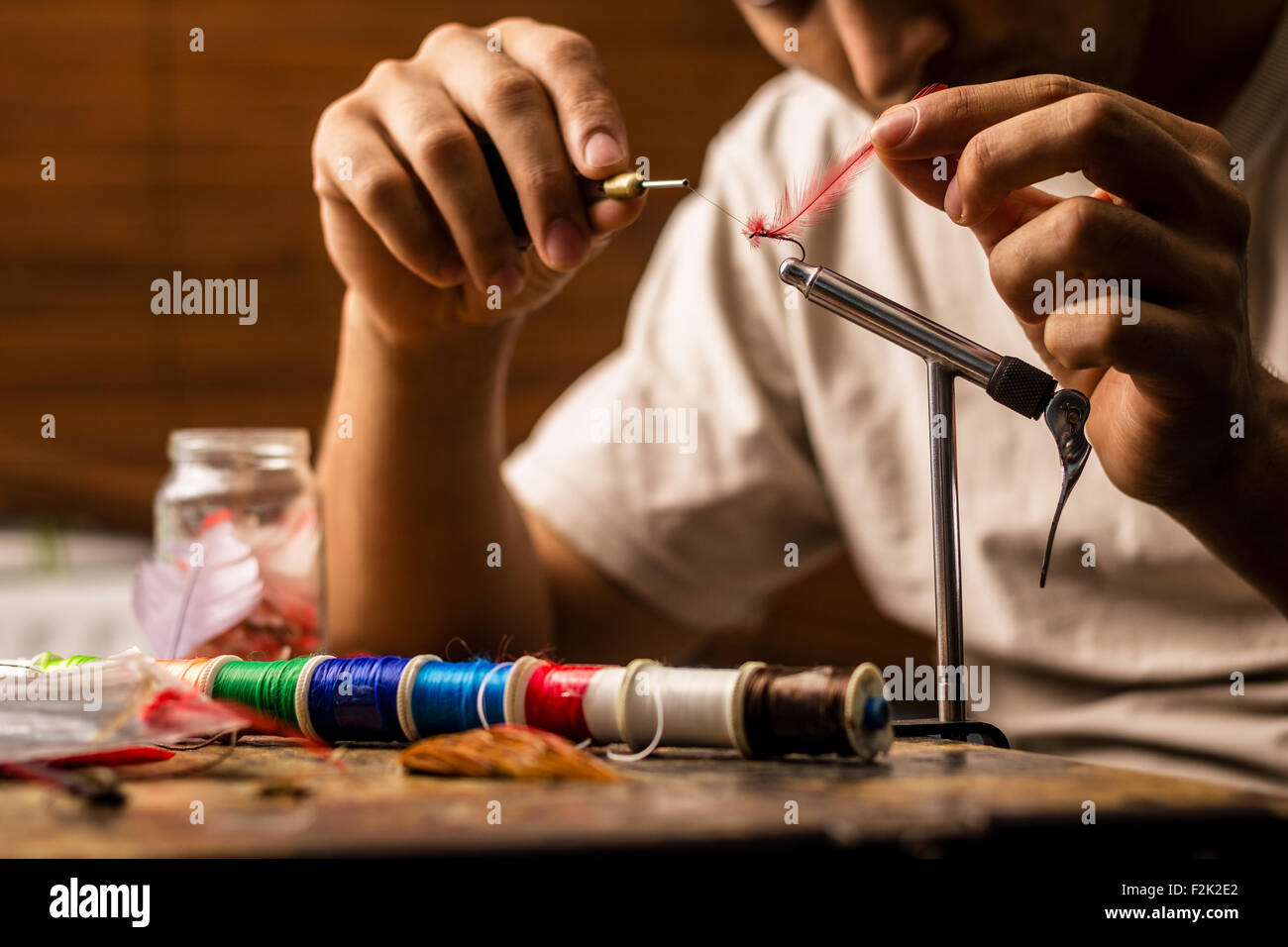 Hands tying hook hi-res stock photography and images - Alamy