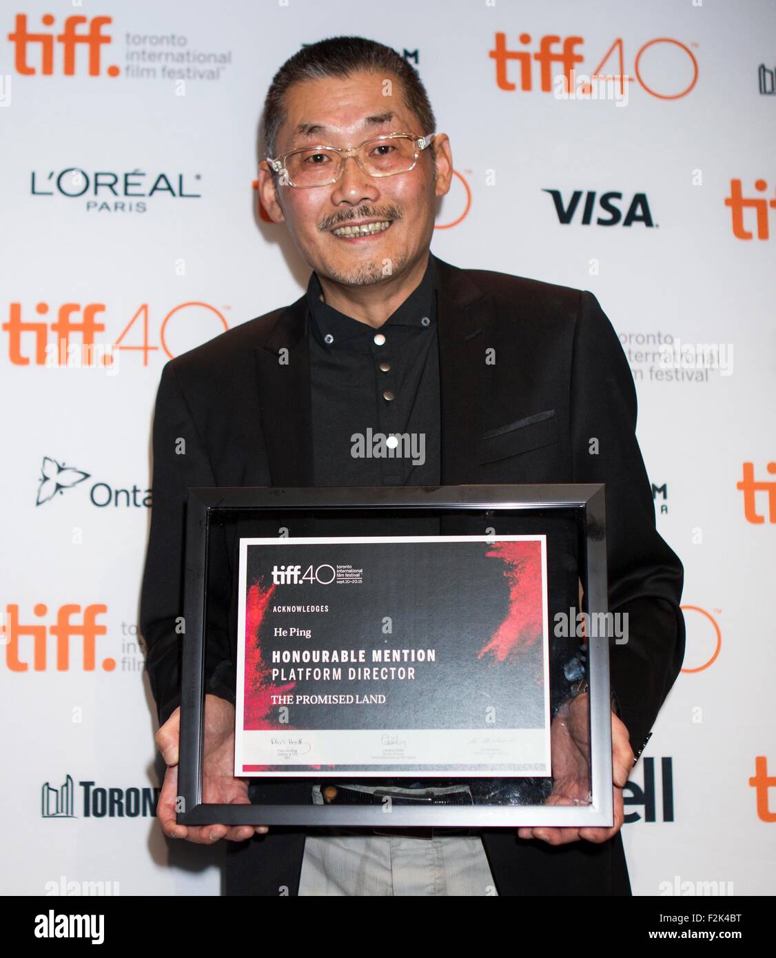 Toronto, Canada. 20th Sep, 2015. Director He Ping poses for photos with ...