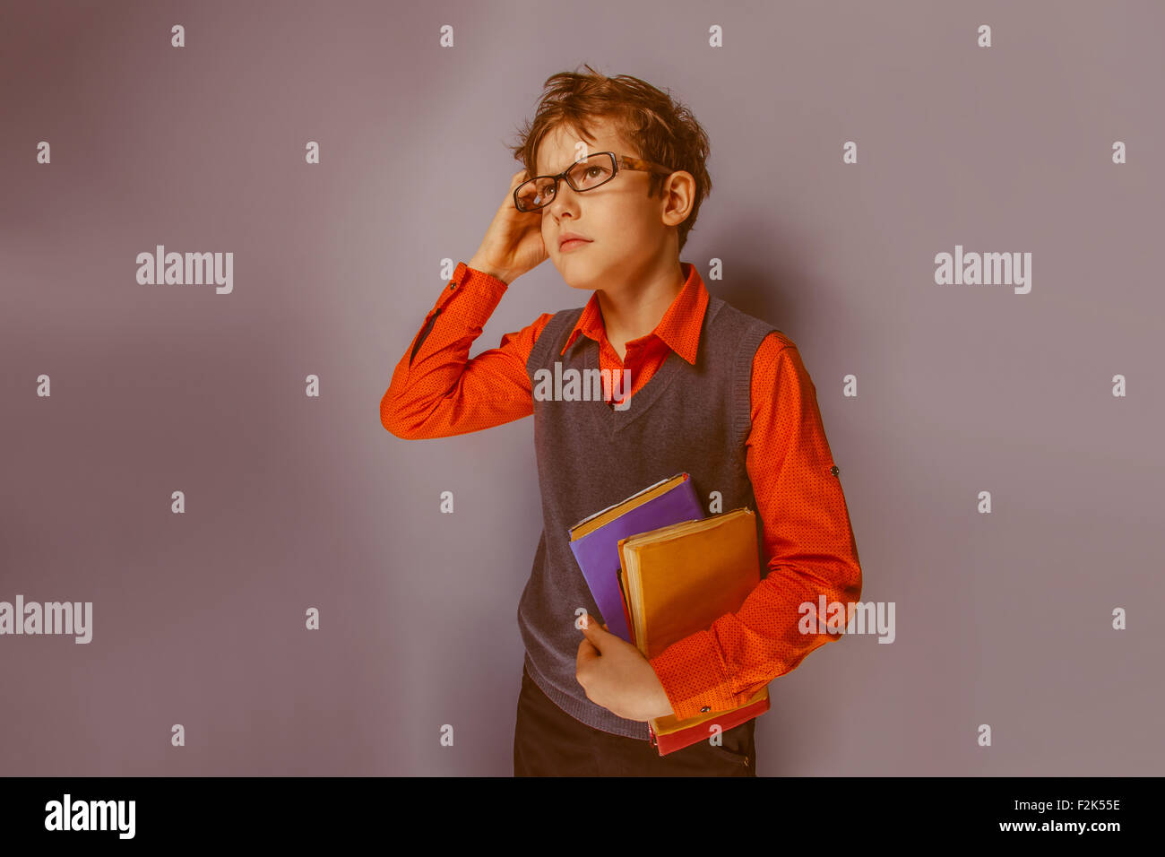 European-looking boy of ten years in glasses thinking intentl Stock ...