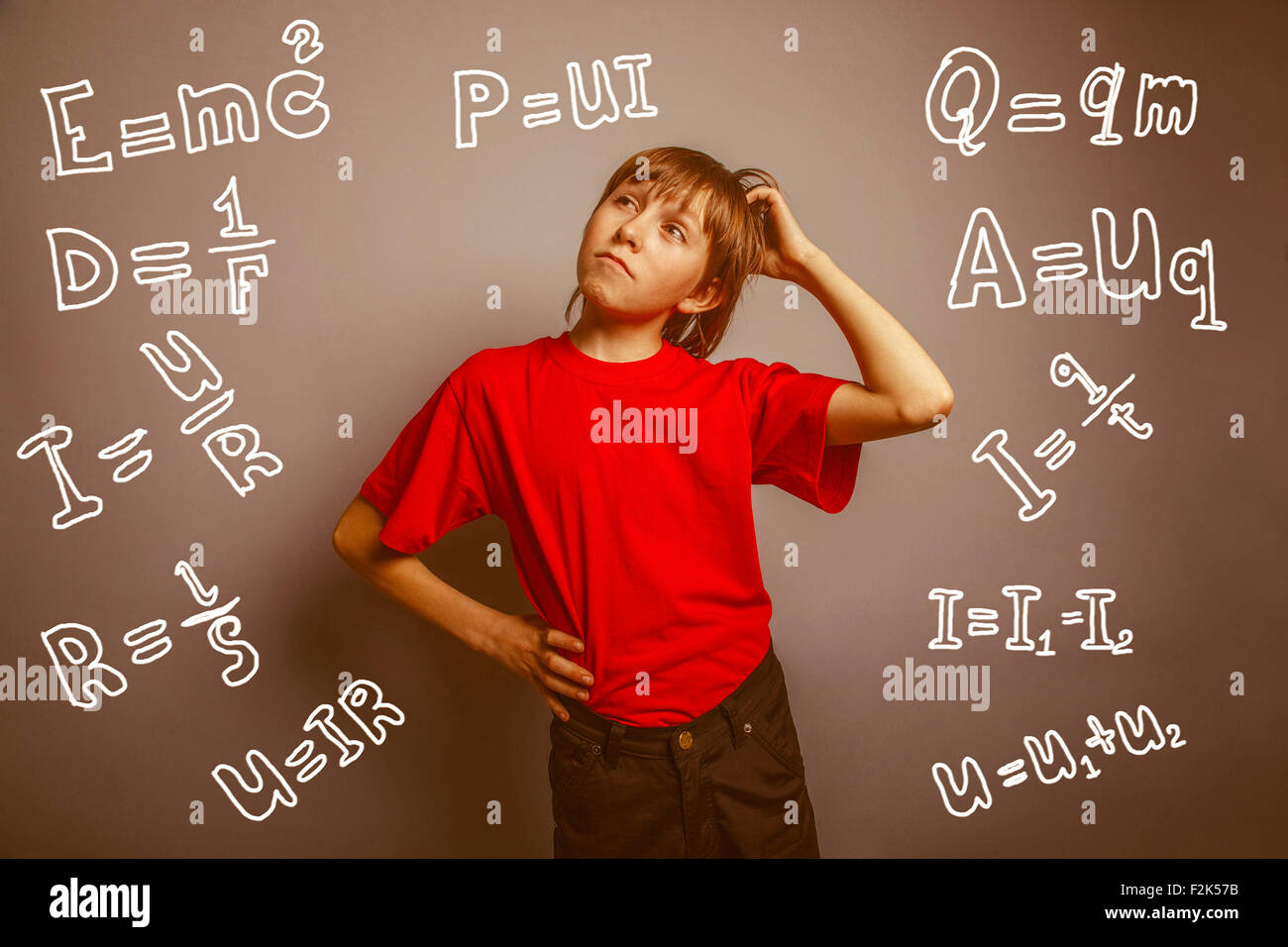 European-looking boy of ten years thinking, scratching his head Stock ...