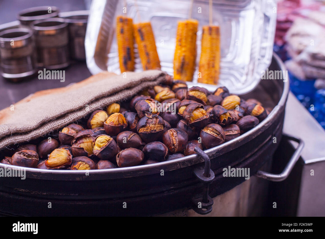 Freshly roasted chestnuts inside a iron plate Stock Photo - Alamy