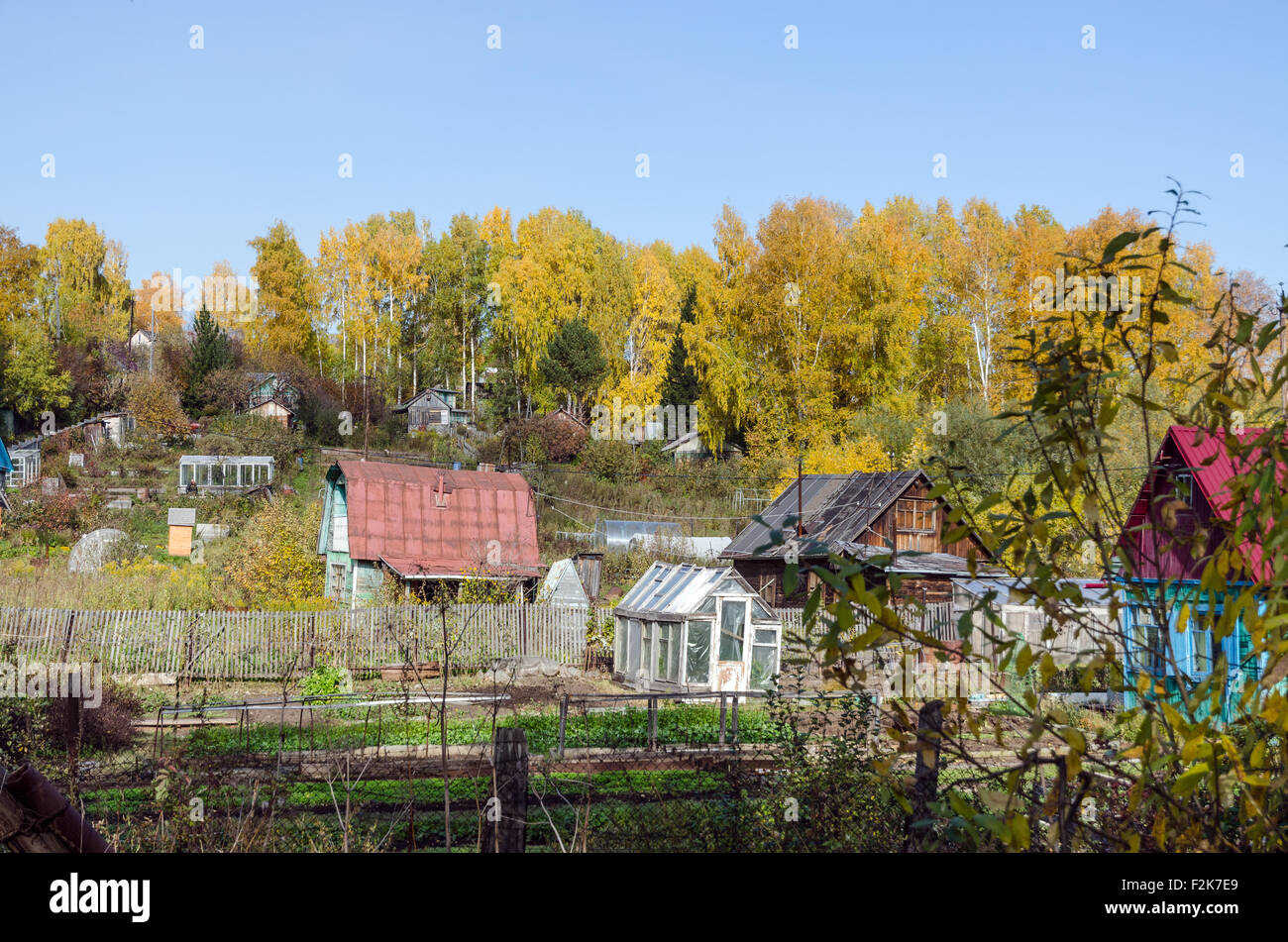 Small cottages in colorful forest at fall time Stock Photo - Alamy