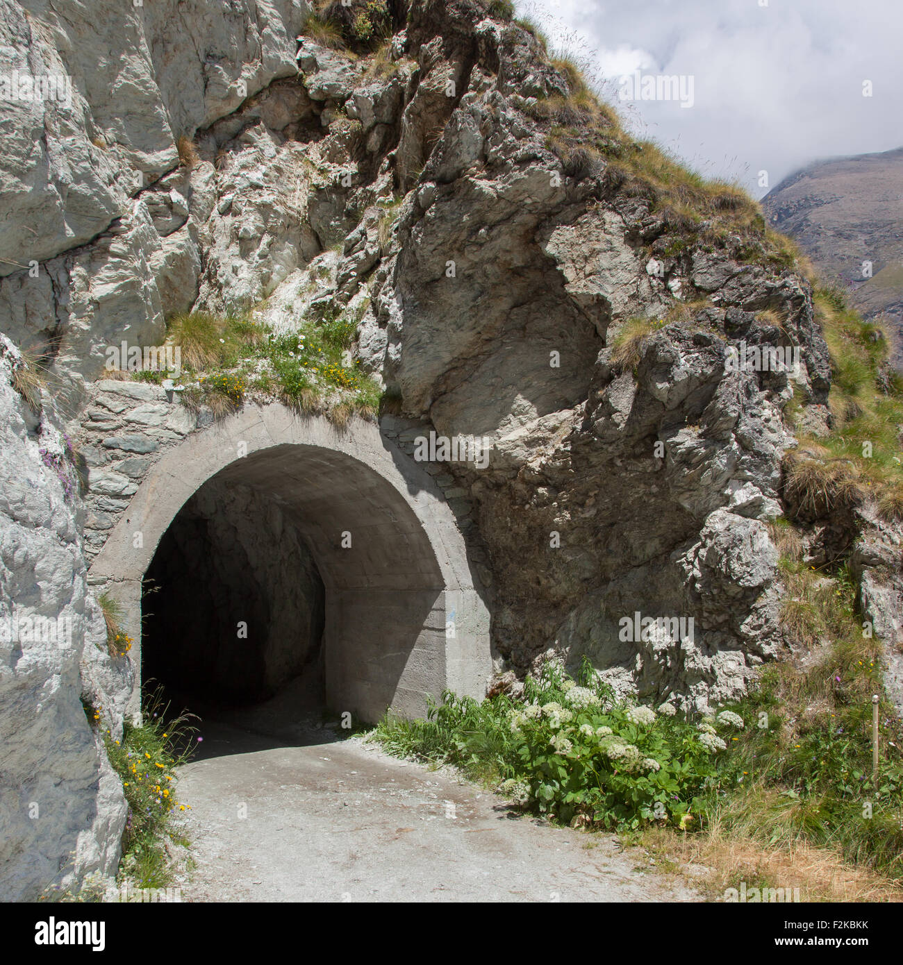Small dark tunnel in a Swiss mountain Stock Photo - Alamy