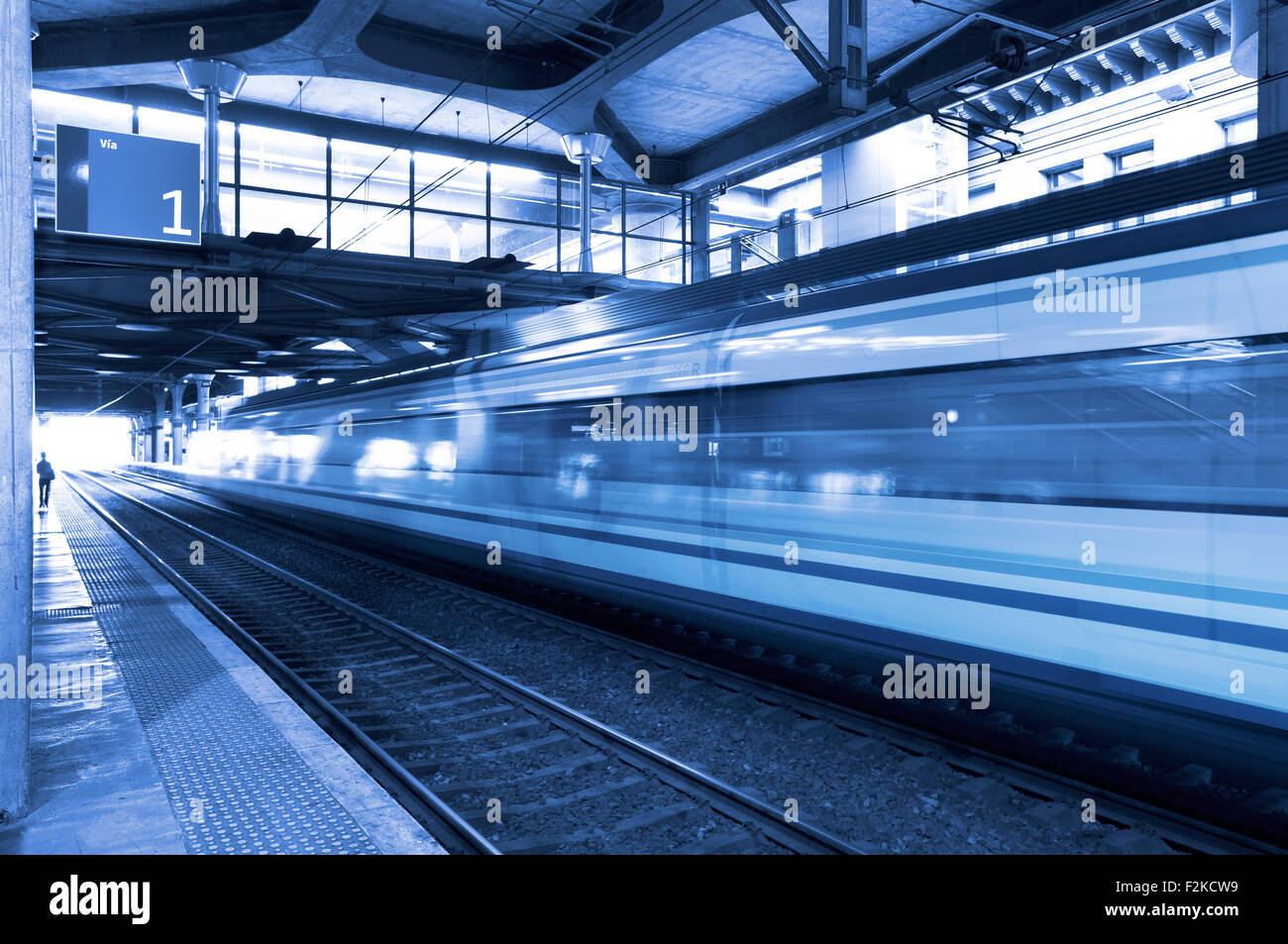 Railway station with short distance train in movement blue tone Stock ...