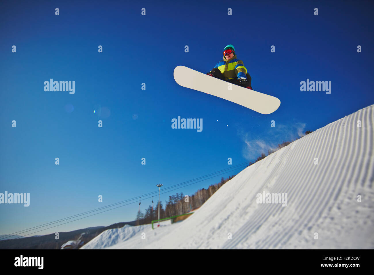 Sportsman practicing snowboarding at winter resort Stock Photo - Alamy
