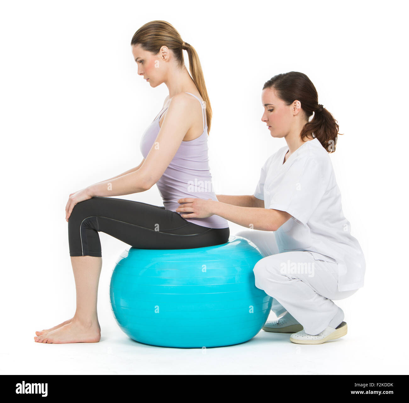 doctor with medical ball and woman patient Stock Photo - Alamy