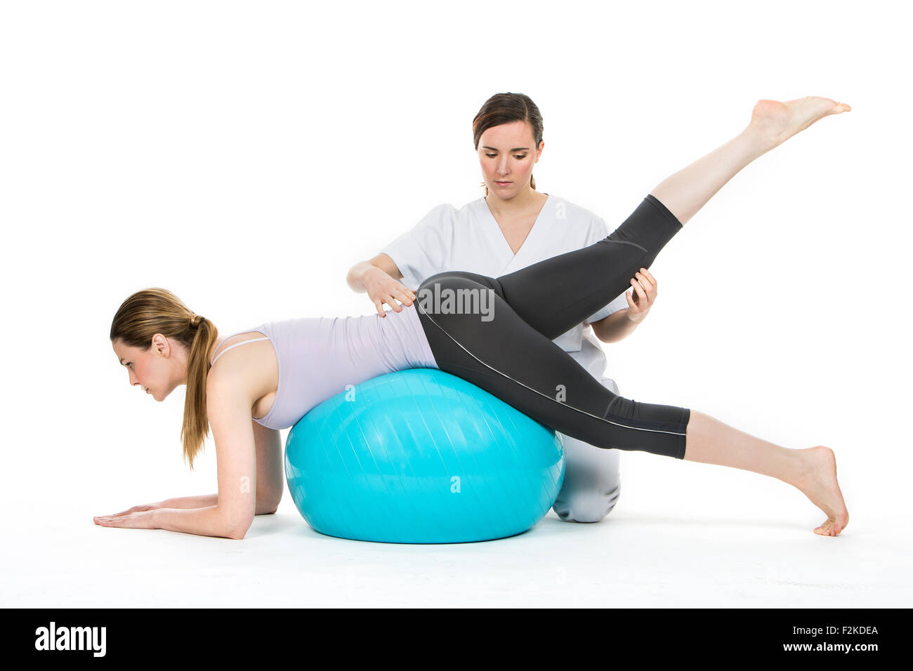 doctor with medical ball and woman patient Stock Photo - Alamy