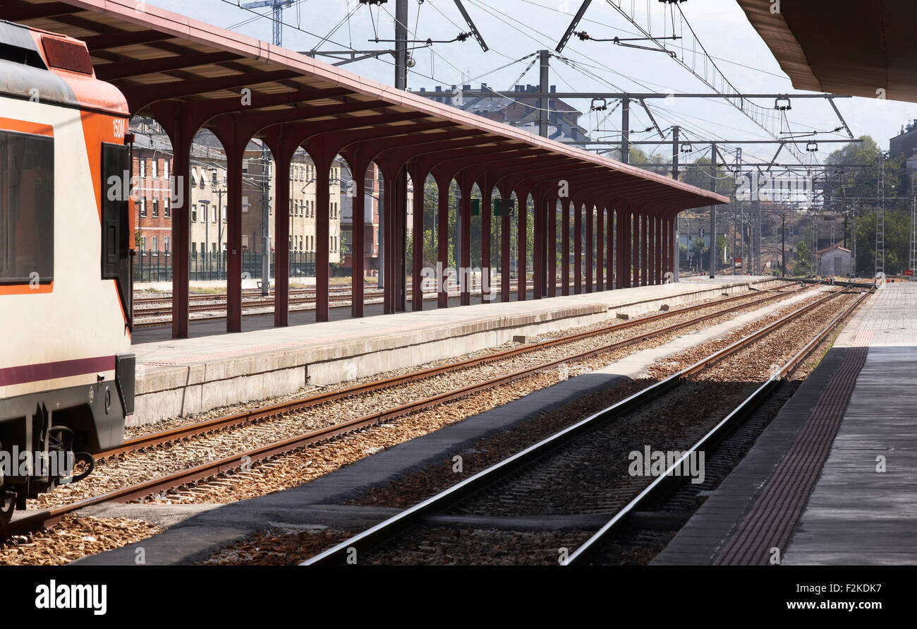 Railway station with platforms and train in a city Stock Photo - Alamy