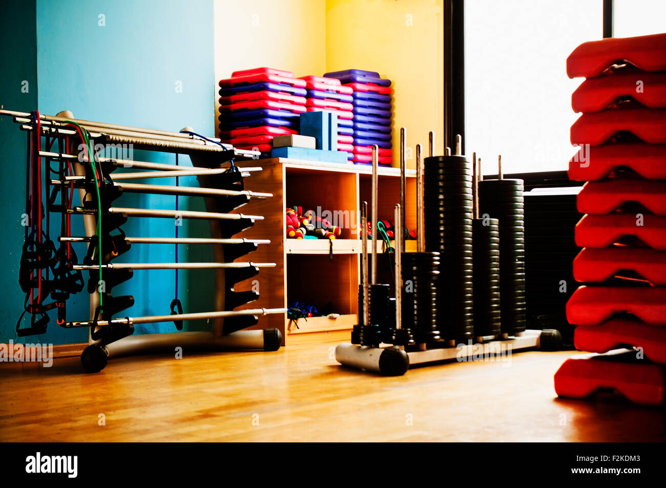 Aerobics equipment in a gym, weights, bars, steps and cx elastic tubes ...