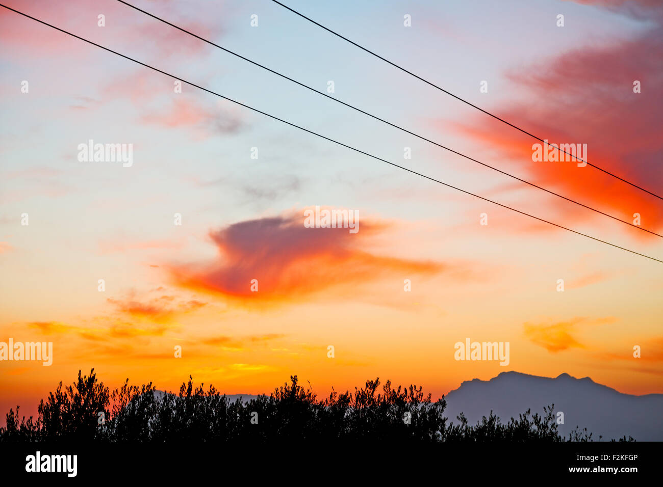 mountain in morocco africa and red sunrise current cables power pylon ...