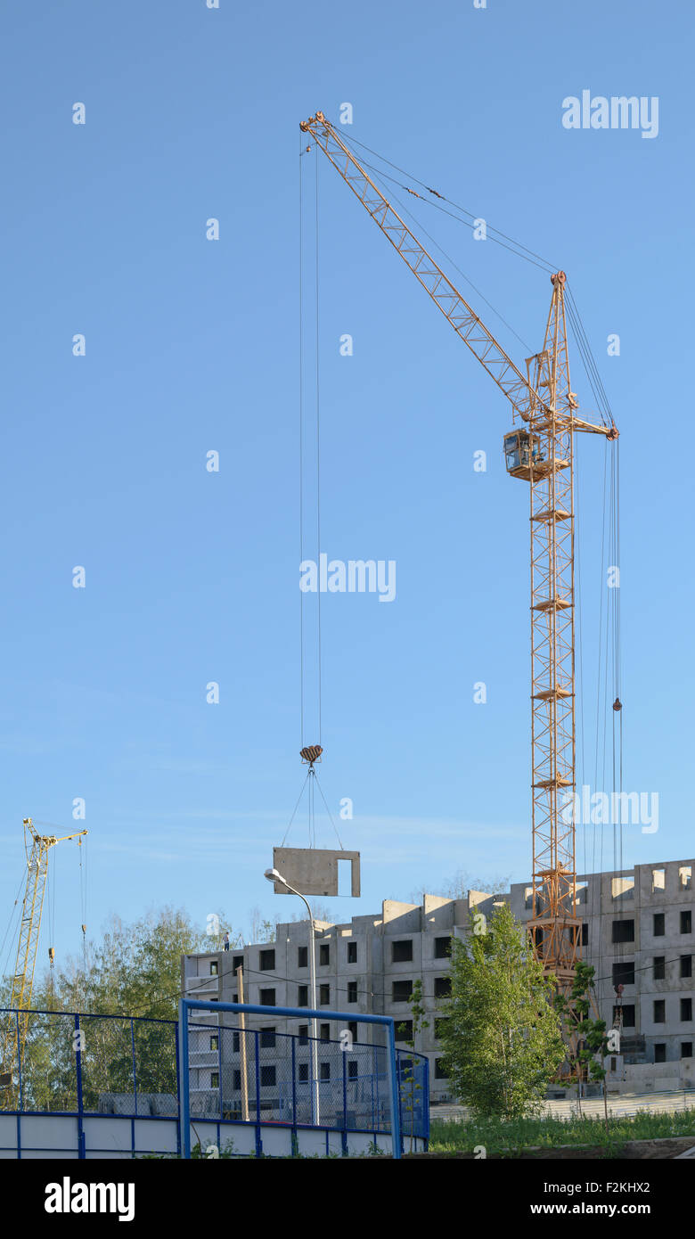 Two green tower cranes hi-res stock photography and images - Alamy