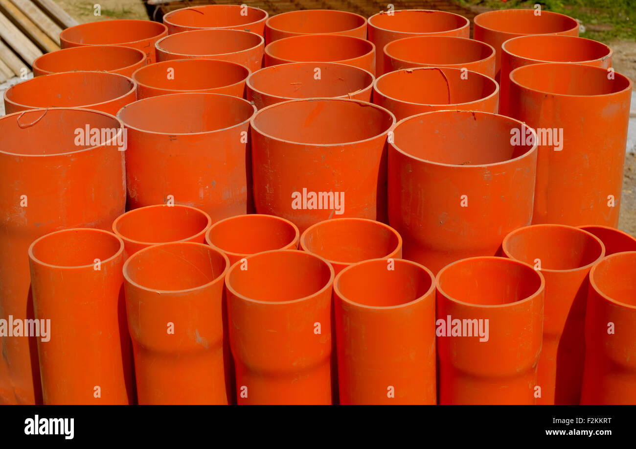 A bundle of red pvc pipes for underground pipelines sewer Stock Photo ...