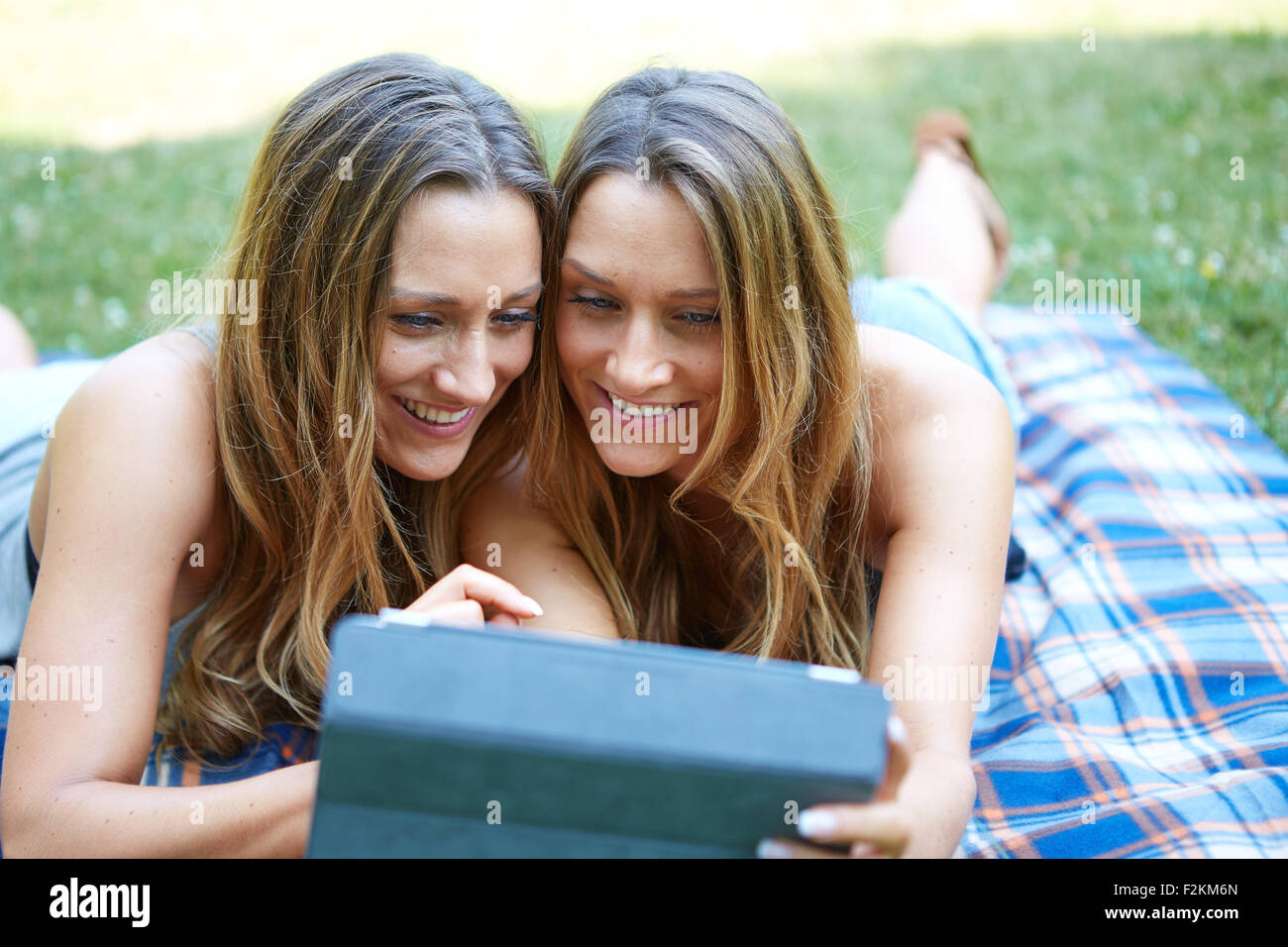 Young woman using tablet outdoor Stock Photo - Alamy
