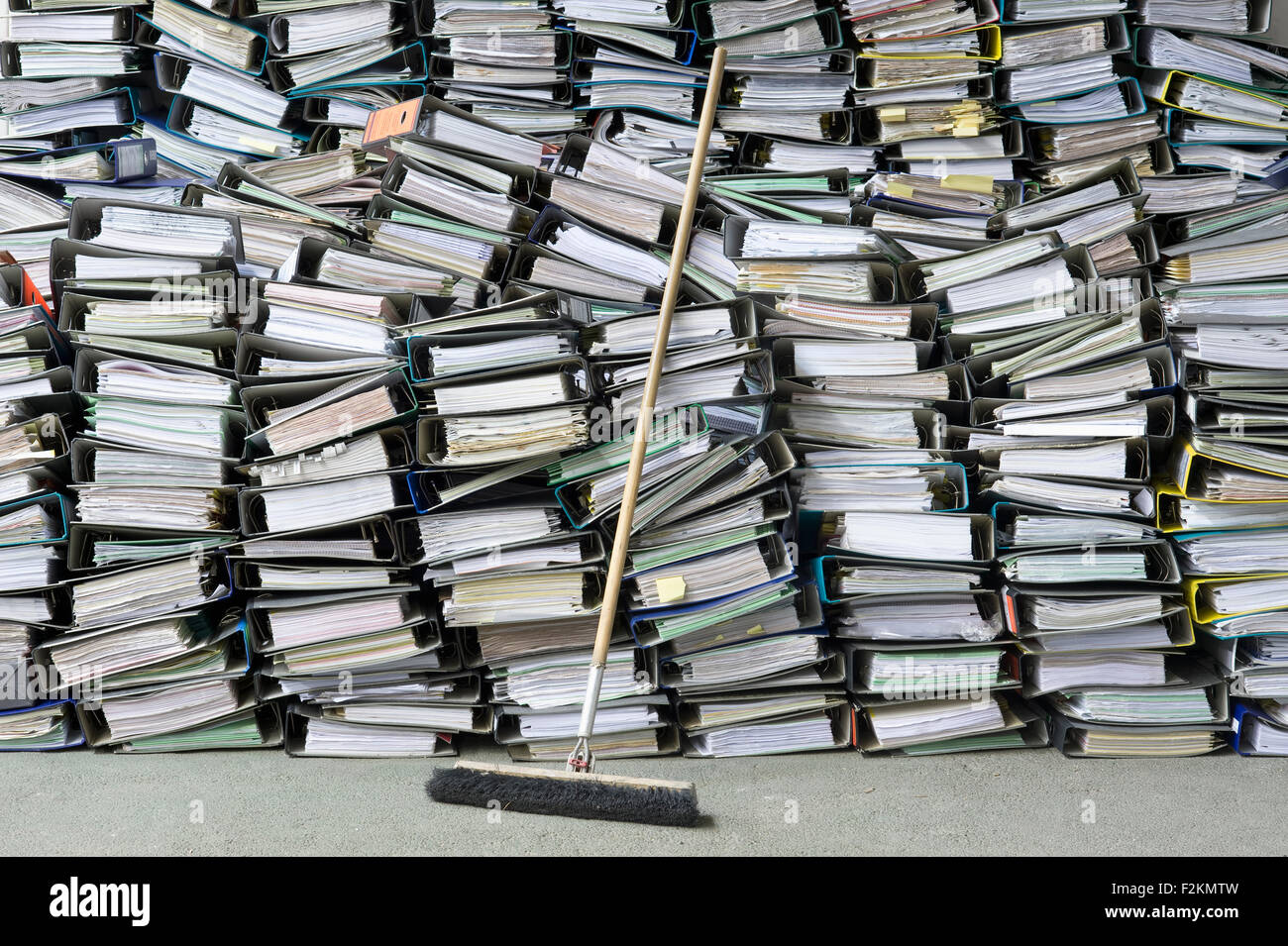 Pile of office files, broom Stock Photo - Alamy