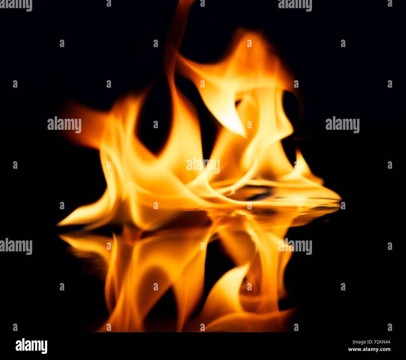 Beautiful stylish fire flames reflected in water Stock Photo - Alamy