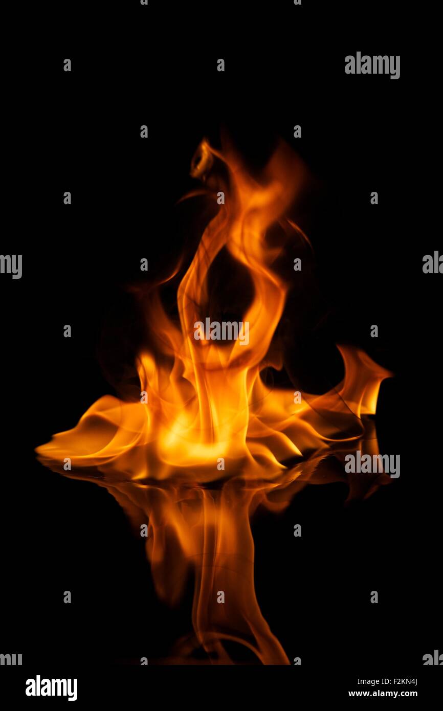 Beautiful stylish fire flames reflected in water Stock Photo - Alamy