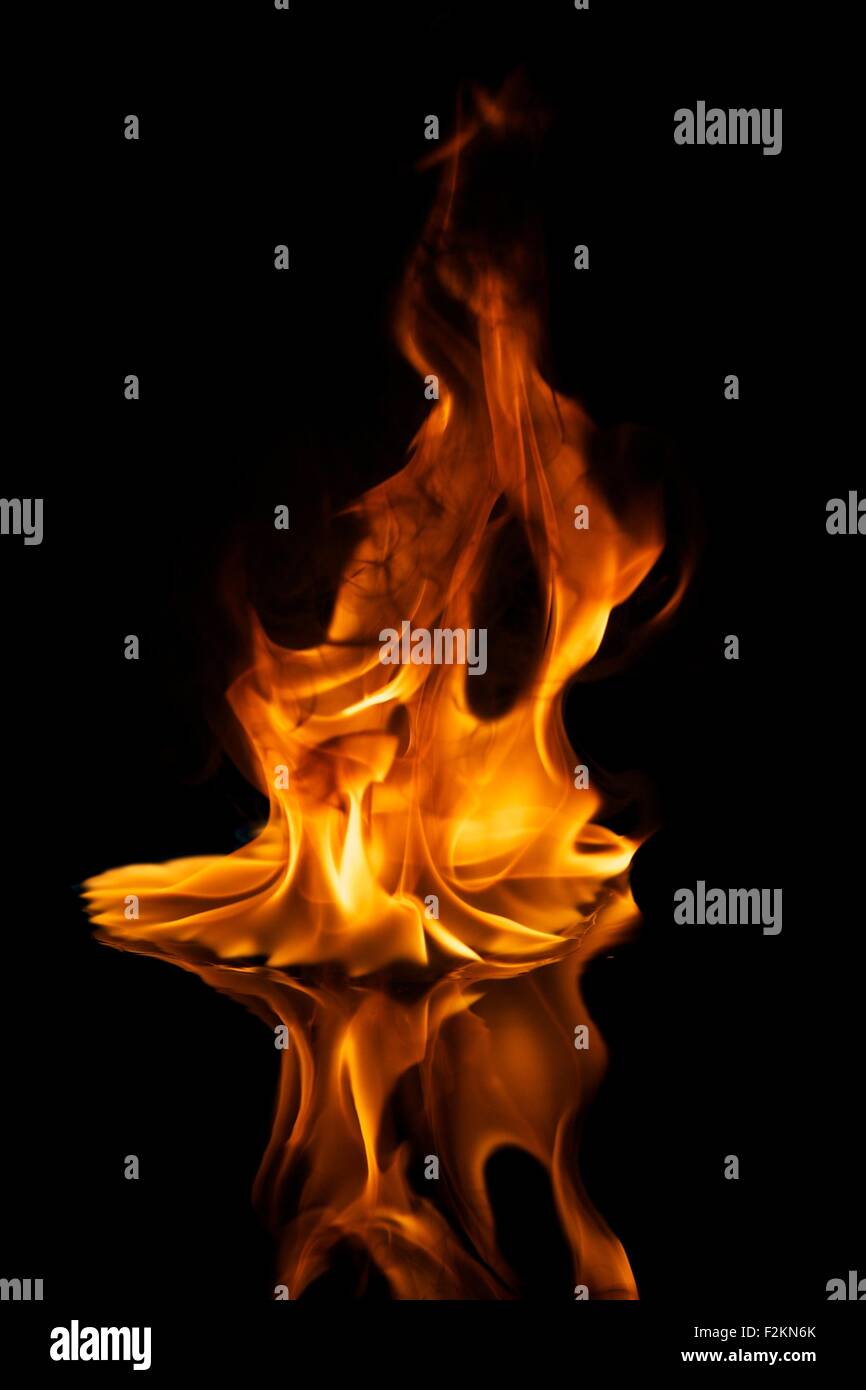 Fire flames reflected in water Stock Photo - Alamy