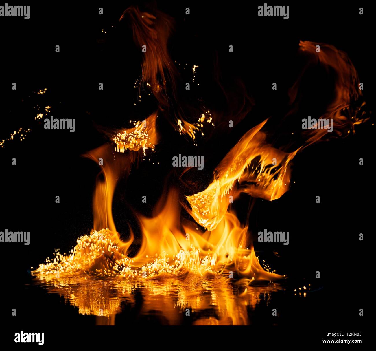 Fire flames reflected in water Stock Photo - Alamy