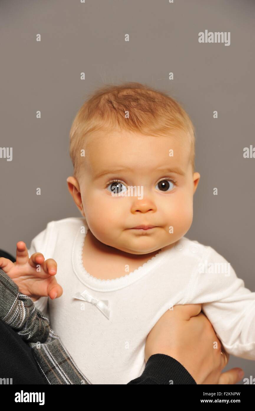 Adorable baby isolated on grey background Stock Photo - Alamy