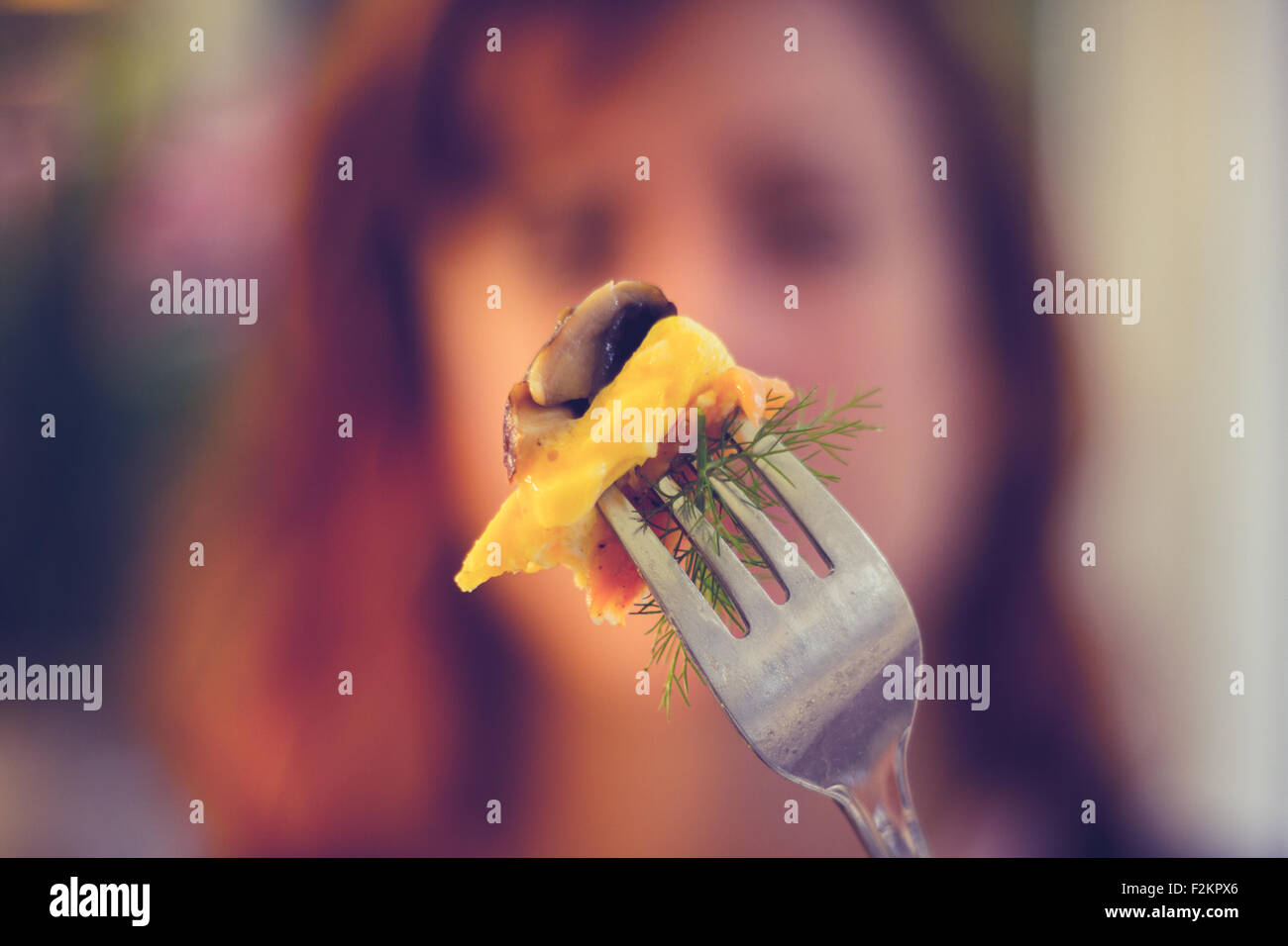 Woman eating food on fork hi-res stock photography and images - Alamy