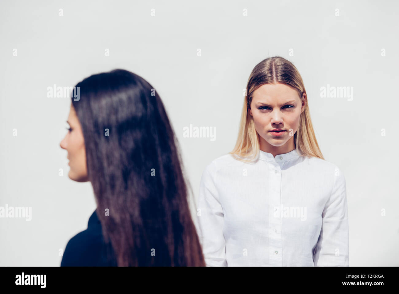 Young women in front of white background Stock Photo - Alamy