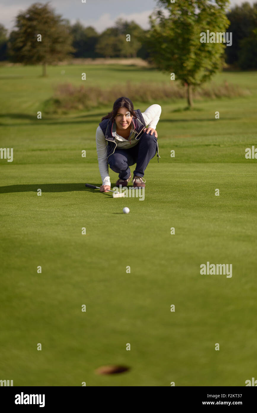 Golfer lining up putt hi-res stock photography and images - Alamy