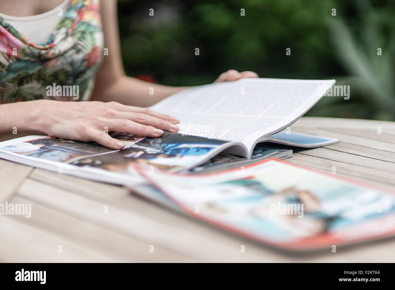 Woman reading magazine, close-up Stock Photo - Alamy
