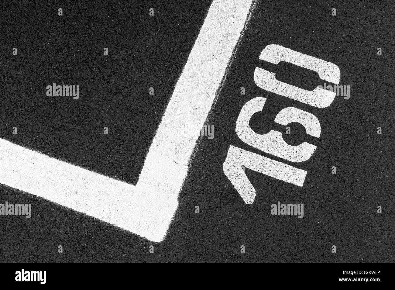 Lane on asphalt road with a number Stock Photo - Alamy