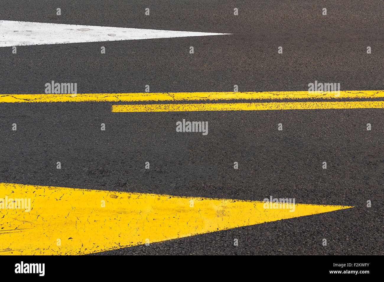 Directional arrows on asphalt road. Selective focus Stock Photo - Alamy