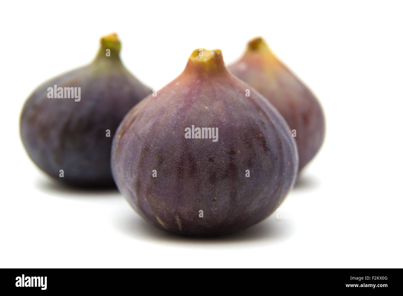ripe purple figs isolated on white background Stock Photo - Alamy