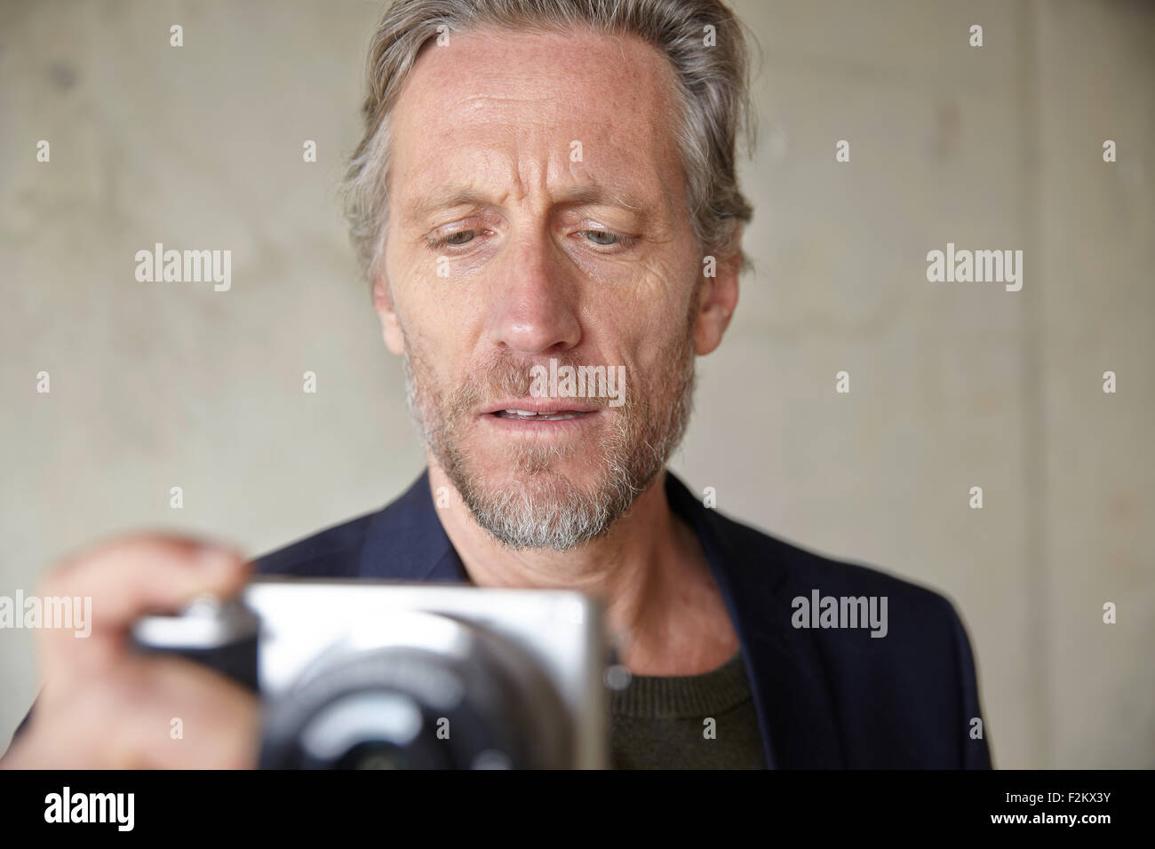 Mature man looking at camera Stock Photo - Alamy