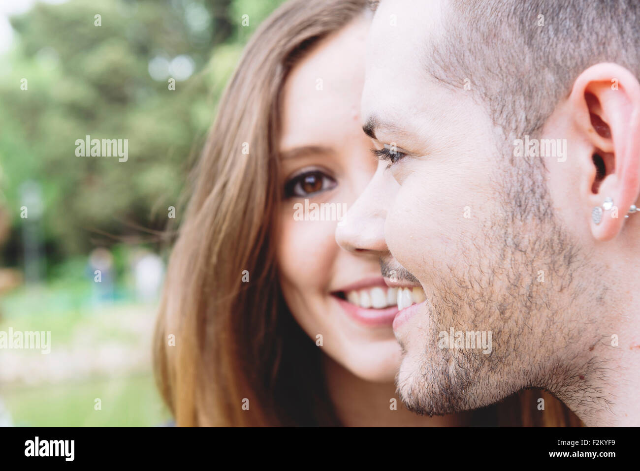 Portrait of young couple building together one face Stock Photo - Alamy