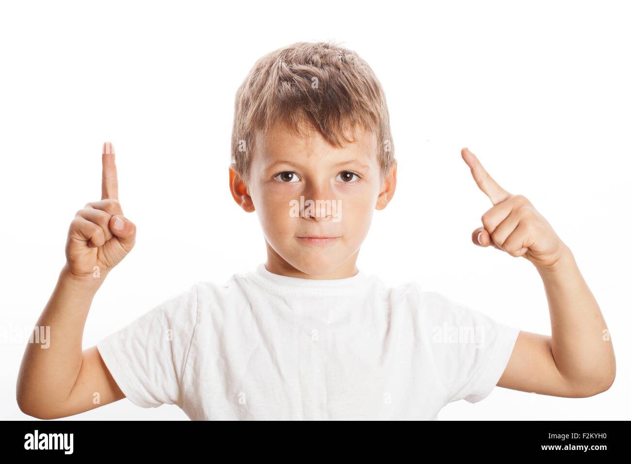 little cute white boy pointing in studio isolated close up Stock Photo ...