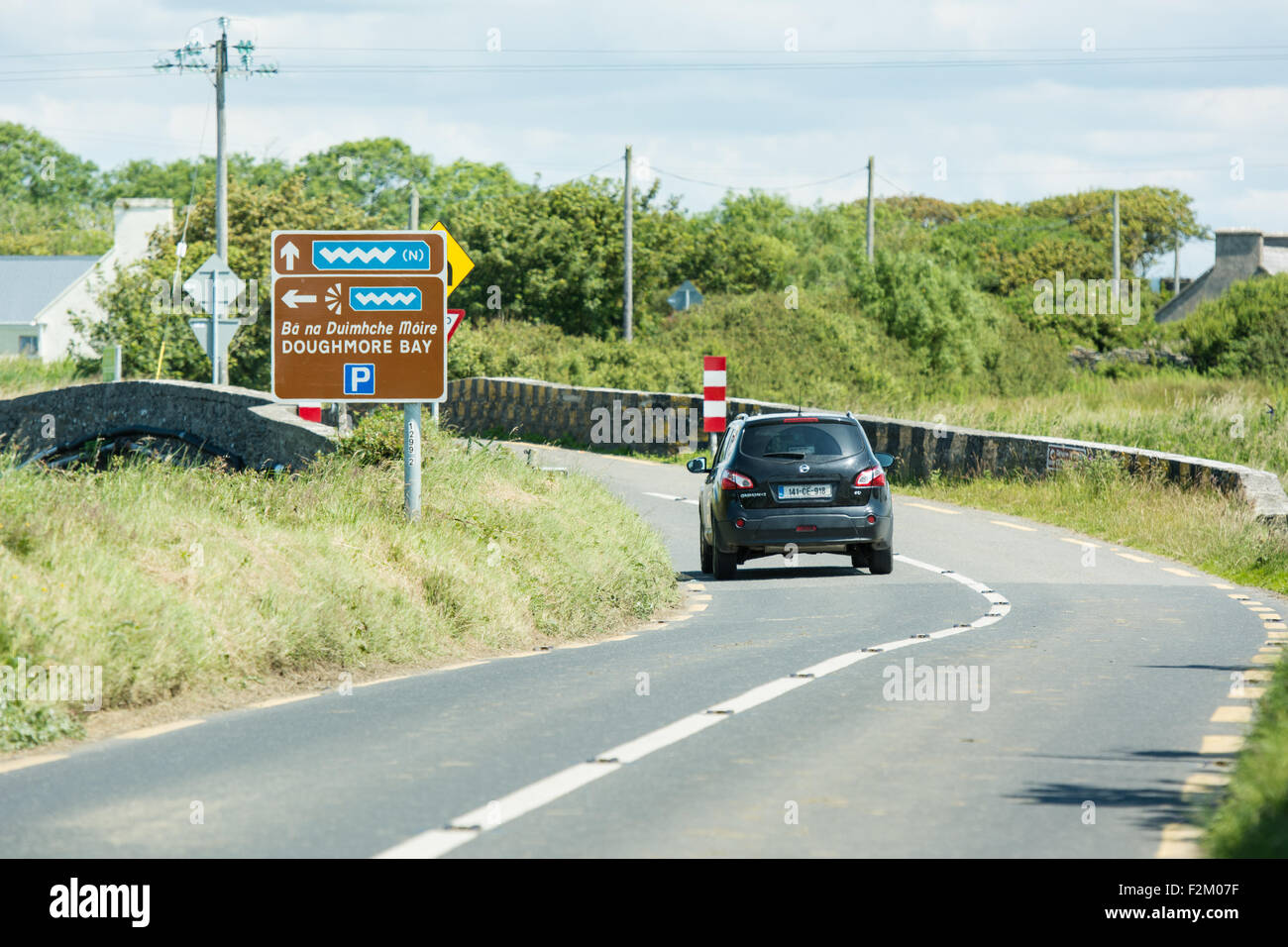 Car passes Wild Atlantic Way signpost on the Road and Touring Route ...