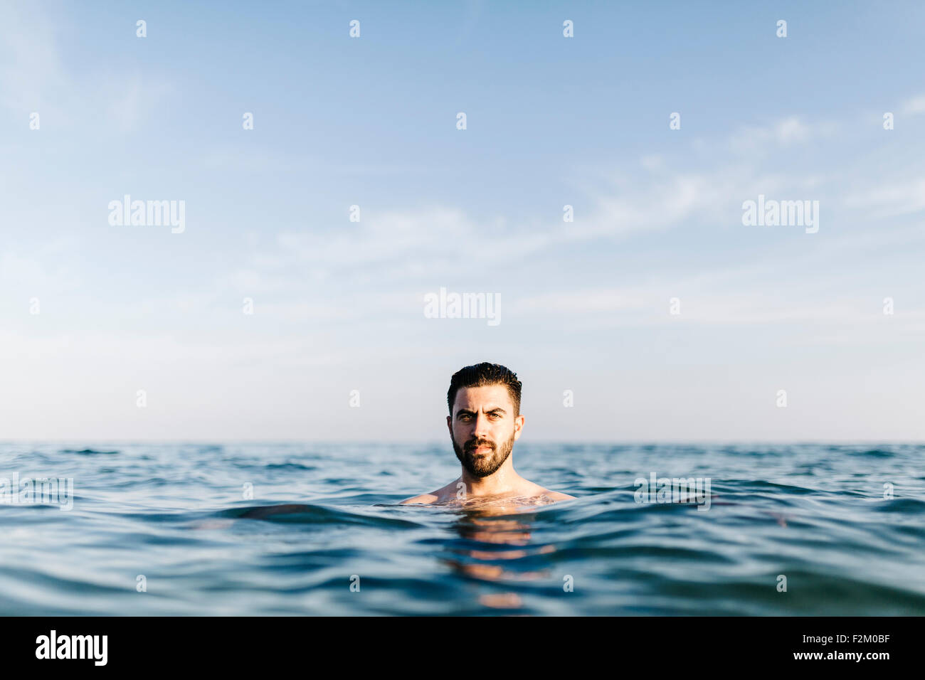 Portrait of young man in the sea Stock Photo - Alamy