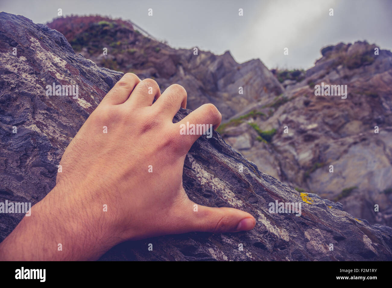 Hand reaching rocks hi-res stock photography and images - Alamy