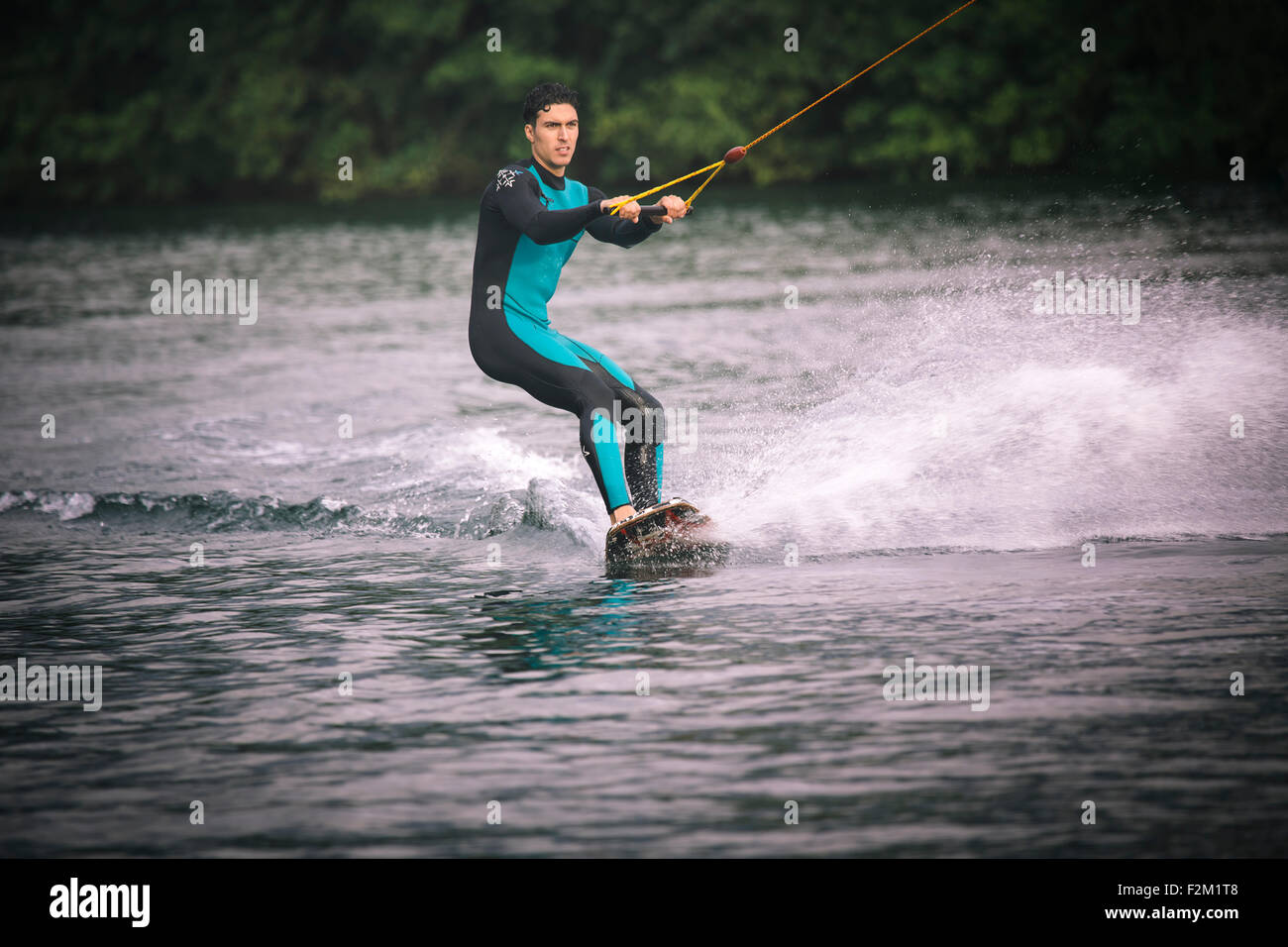 Young man wakeboarding Stock Photo - Alamy