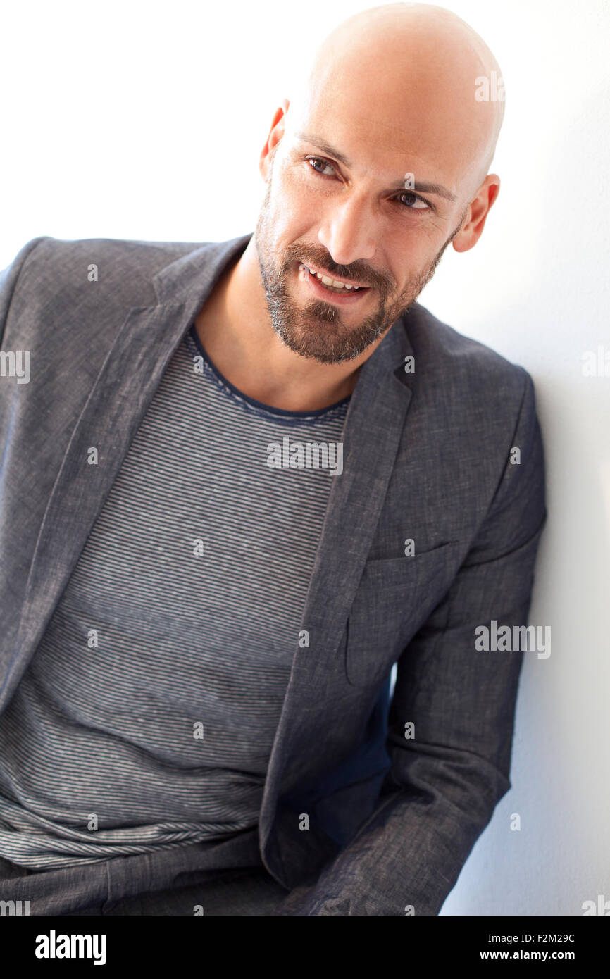 Portrait of bald man wearing grey suit Stock Photo - Alamy