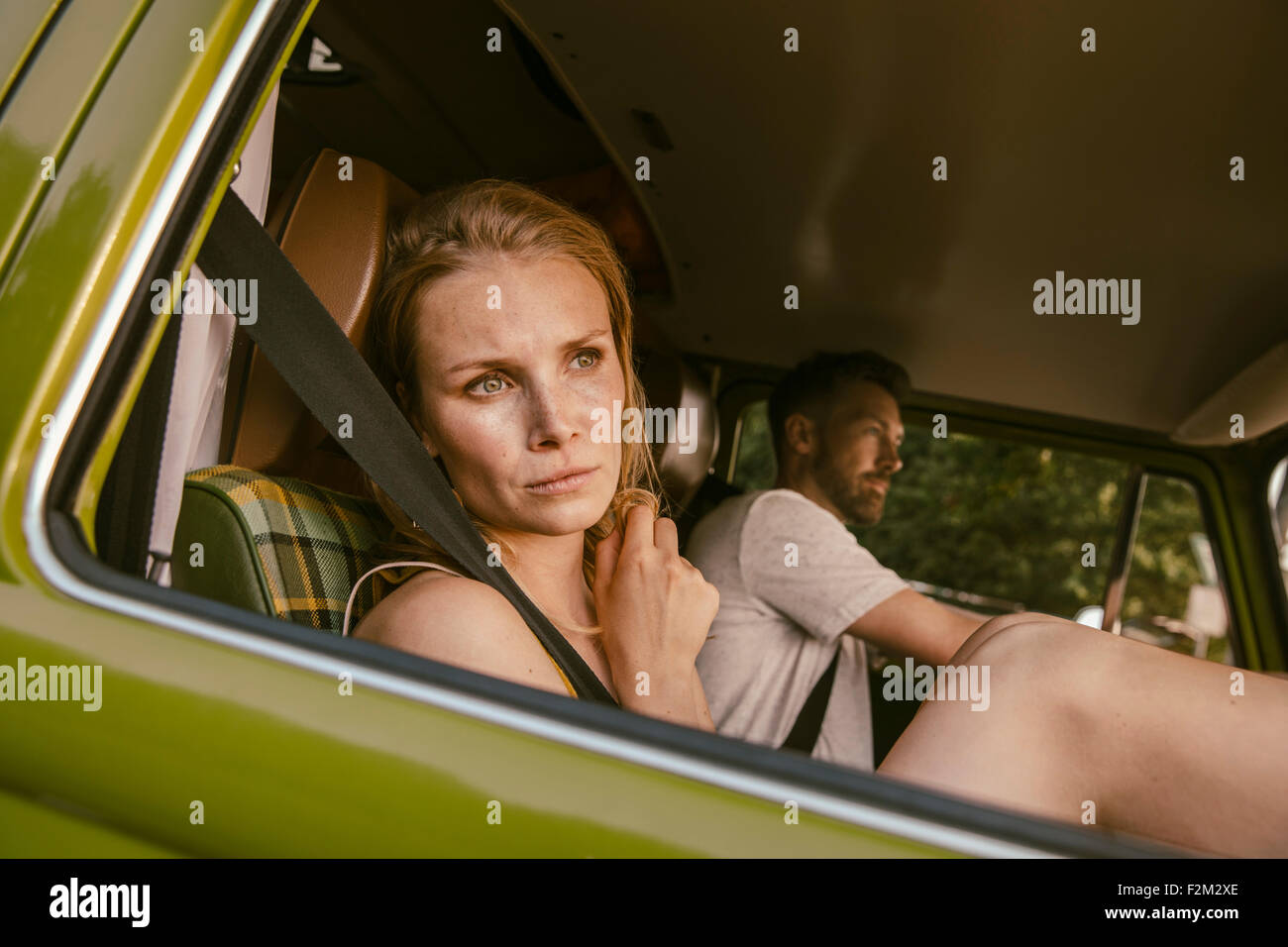 Woman in van on a road trip looking out of the window Stock Photo - Alamy