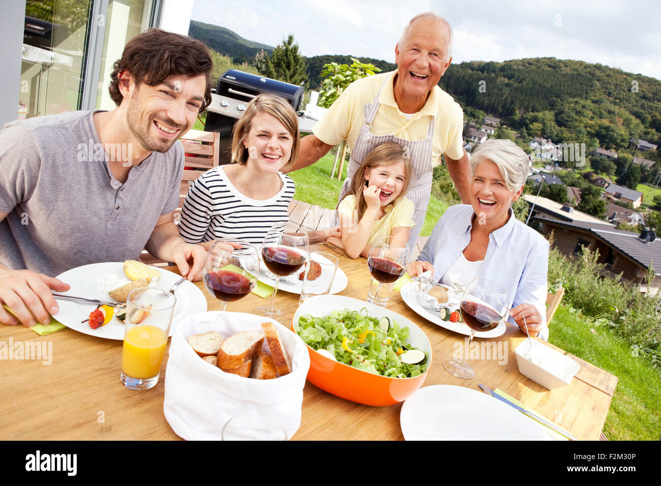 Happy Extended Family Having Garden Party High Resolution Stock ...