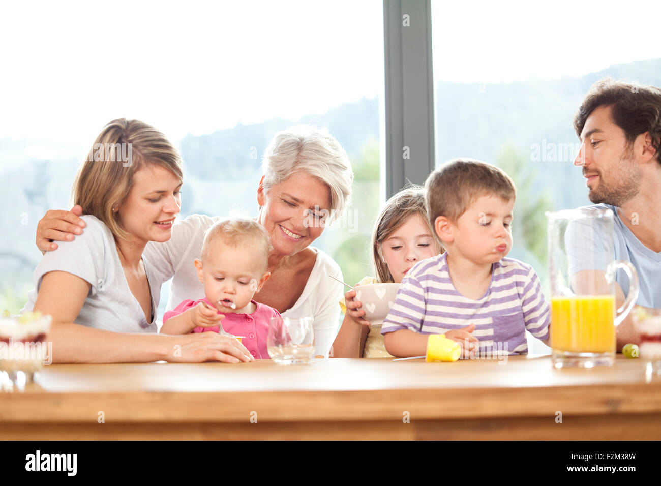 Extended family having breakfast together Stock Photo - Alamy