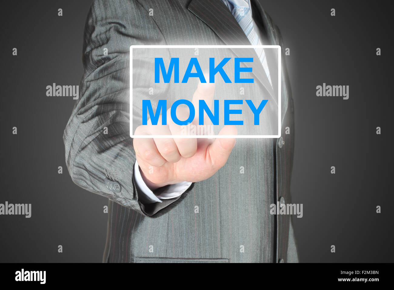 Businessman pushing virtual make money button on black background Stock ...