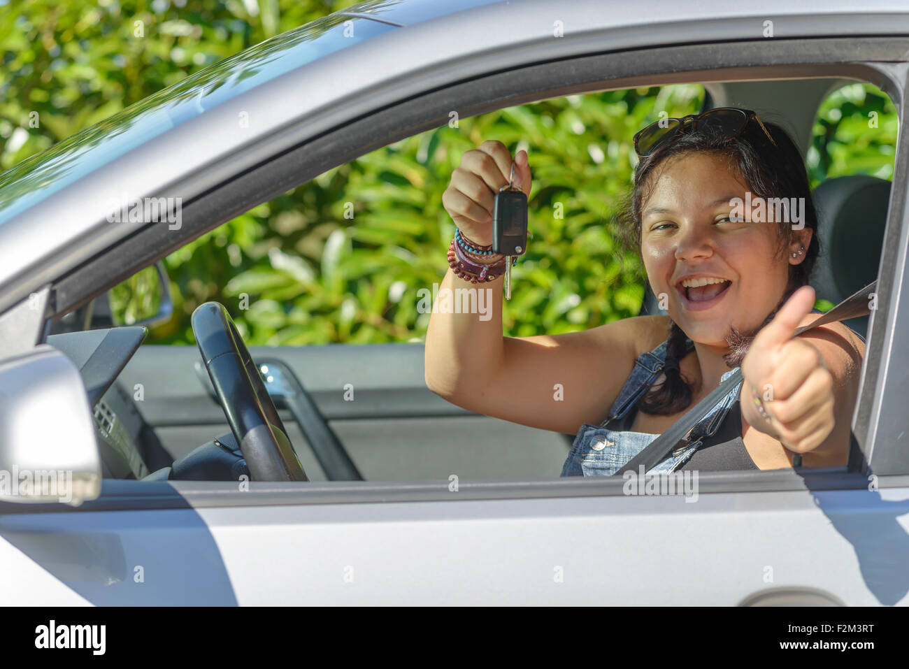 a young girl has driving license Stock Photo - Alamy